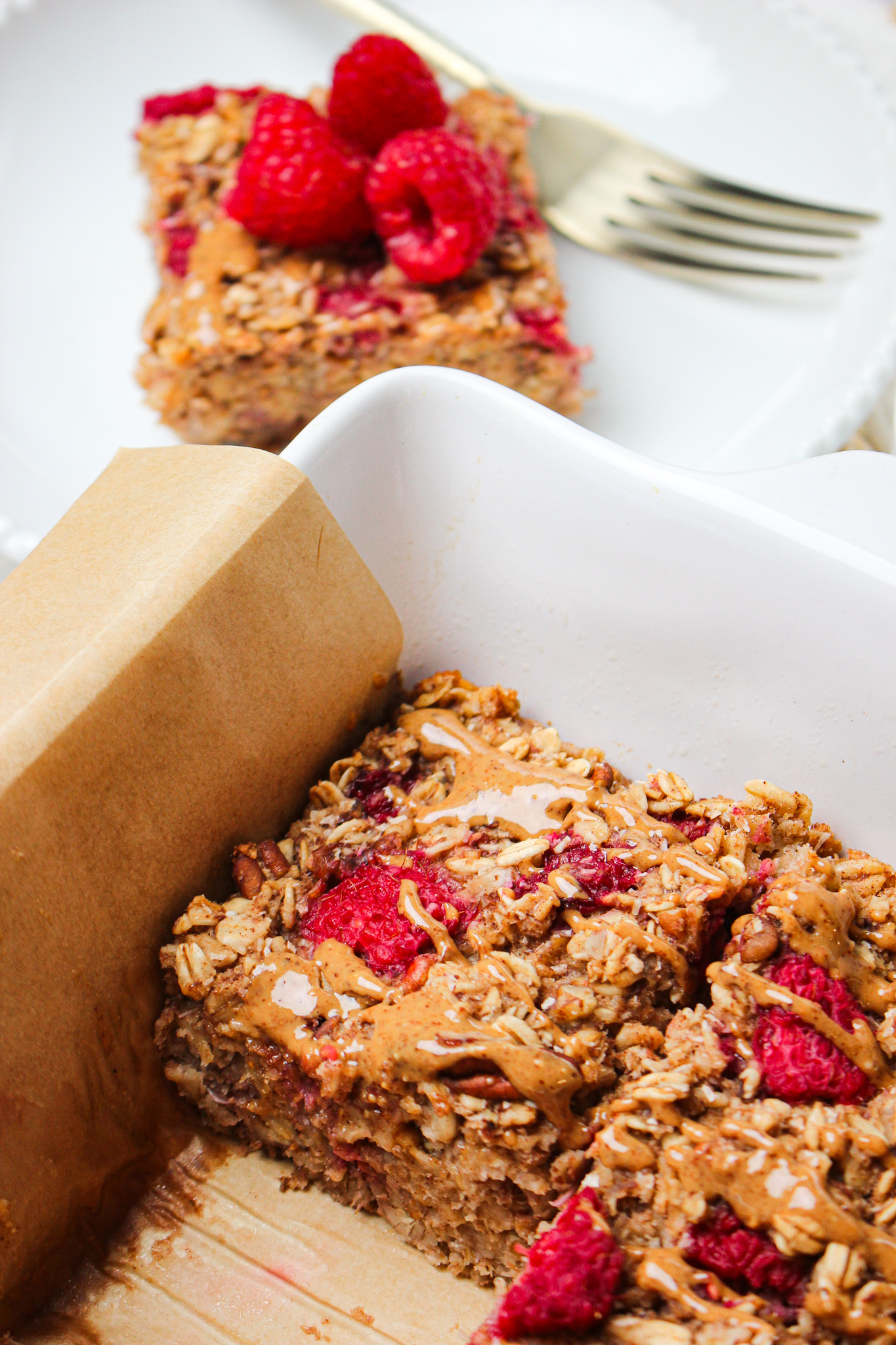 Vegan Raspberry Baked Oatmeal with Almond Butter Drizzle - The Happy ...
